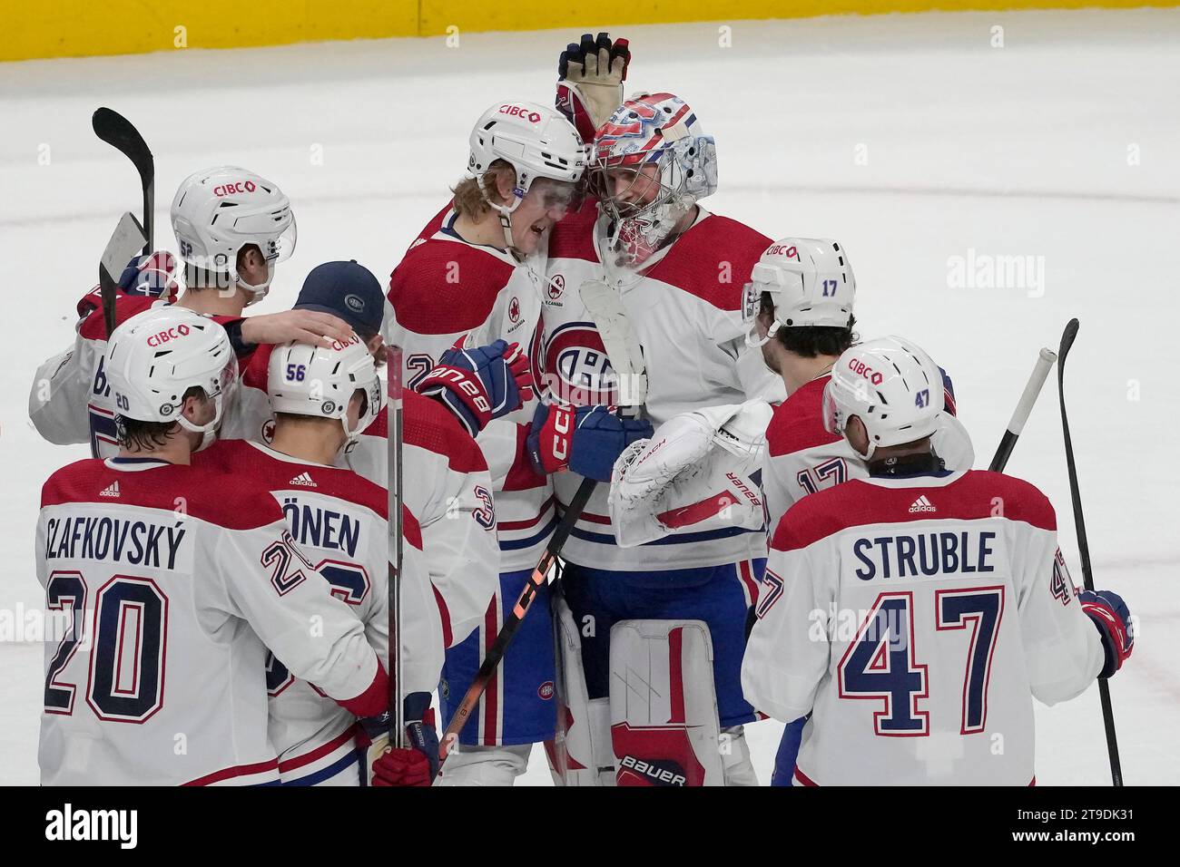Montreal Canadiens goaltender Cayden Primeau, top right, is ...