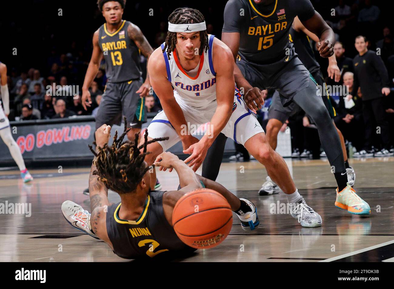 Florida guard Walter Clayton Jr. (1) fights for the ball against Baylor ...