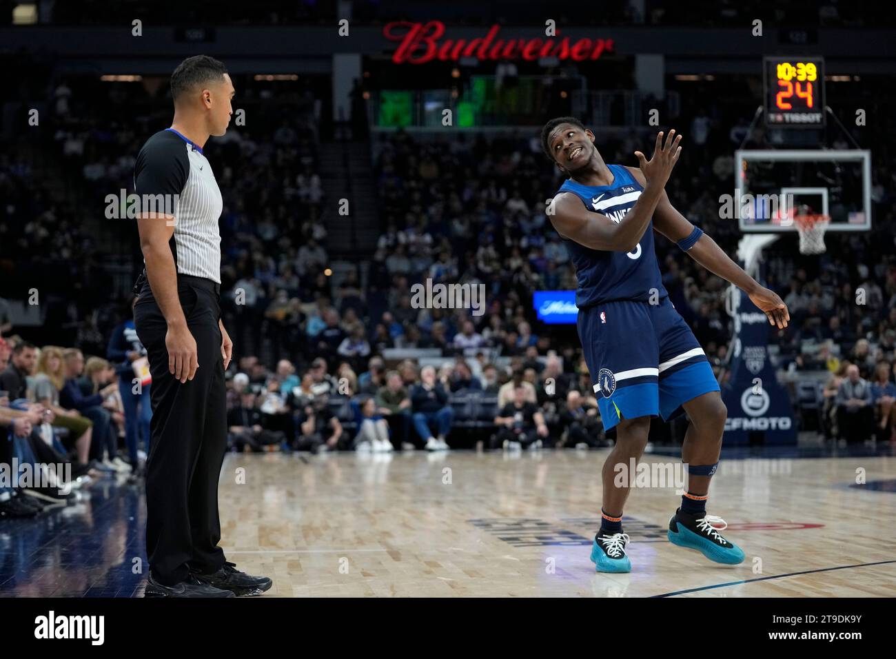 Minnesota Timberwolves guard Anthony Edwards, right, talks with a ...