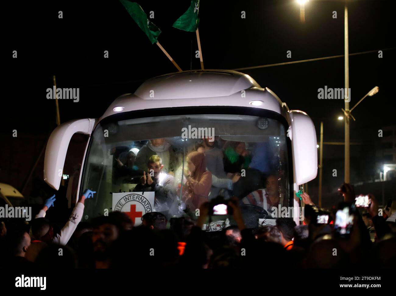 Beitunia. 24th Nov, 2023. Released Palestinian prisoners are seen on a ...