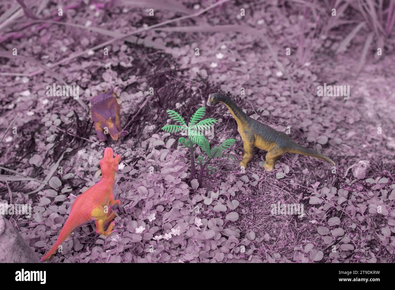 infrared image of the dinosaur toys the bushy grassland Stock Photo - Alamy