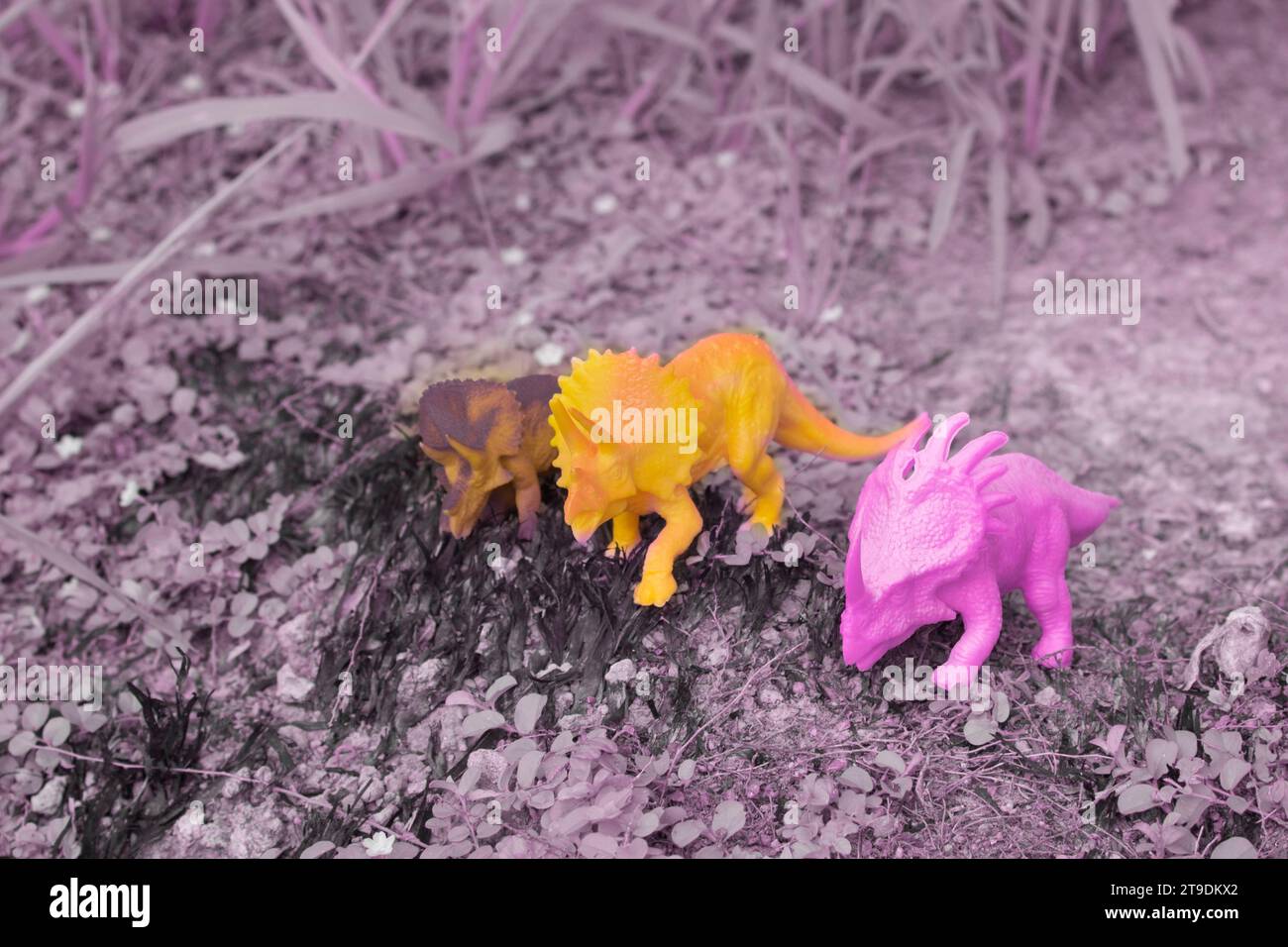 infrared image of the dinosaur toys the bushy grassland Stock Photo - Alamy