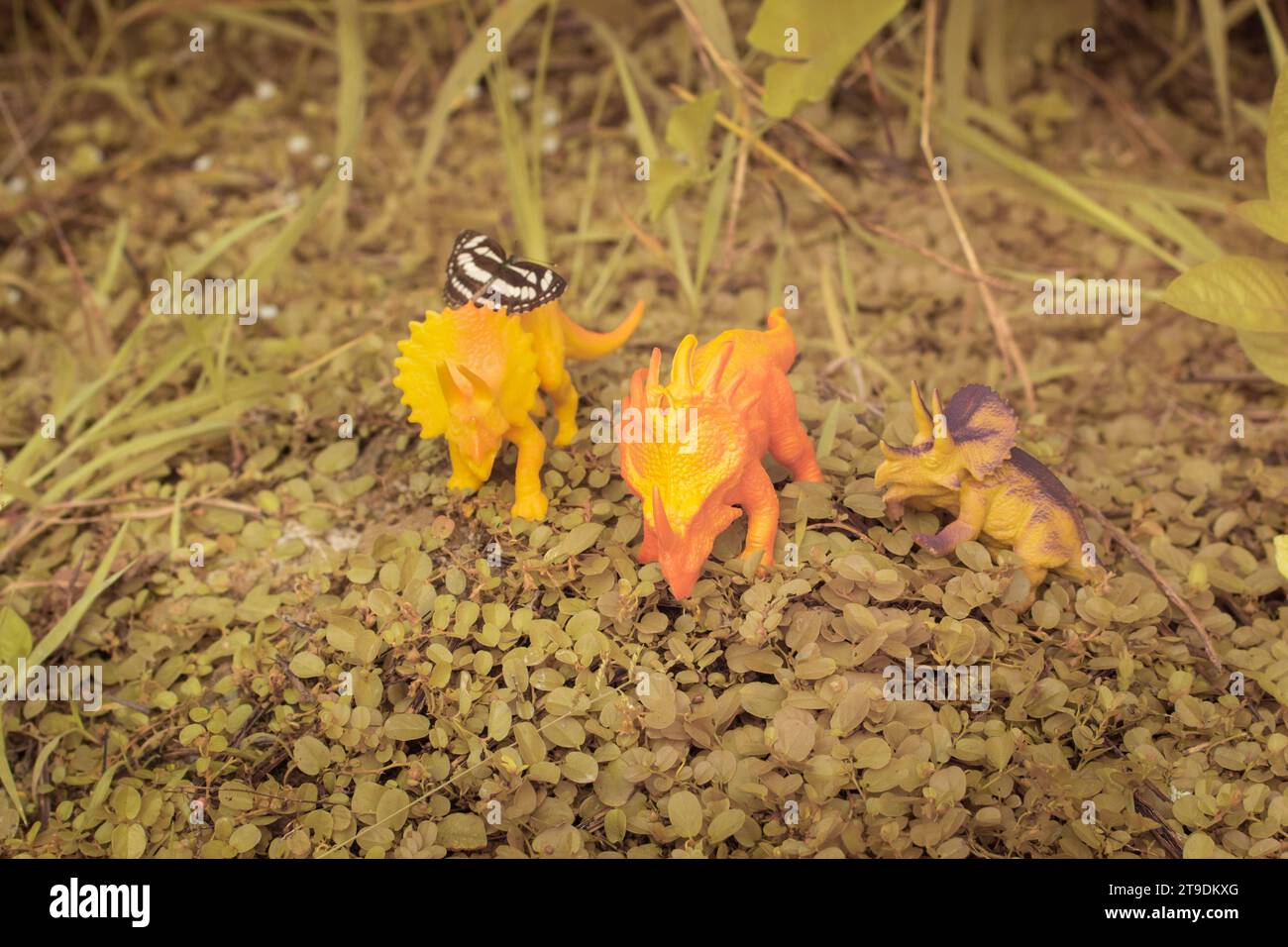 infrared image of the dinosaur toys the bushy grassland Stock Photo - Alamy