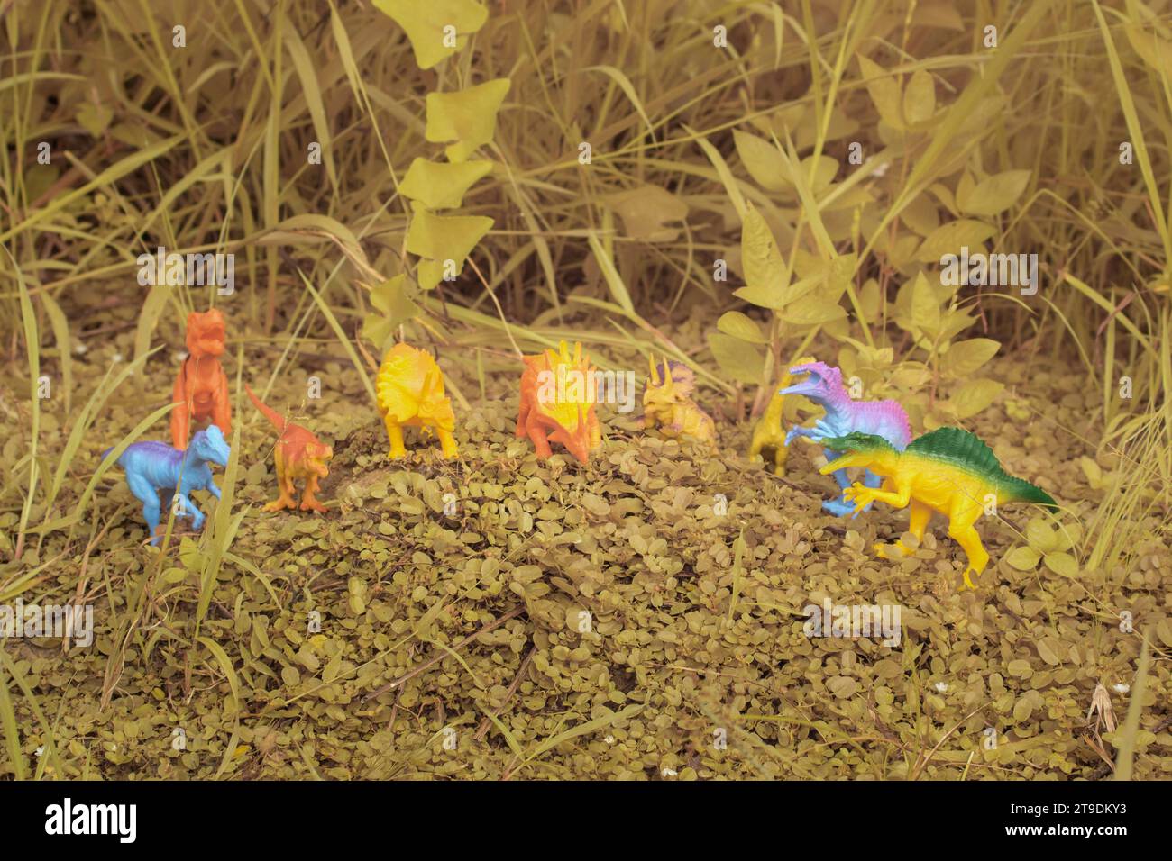 infrared image of the dinosaur toys the bushy grassland Stock Photo - Alamy