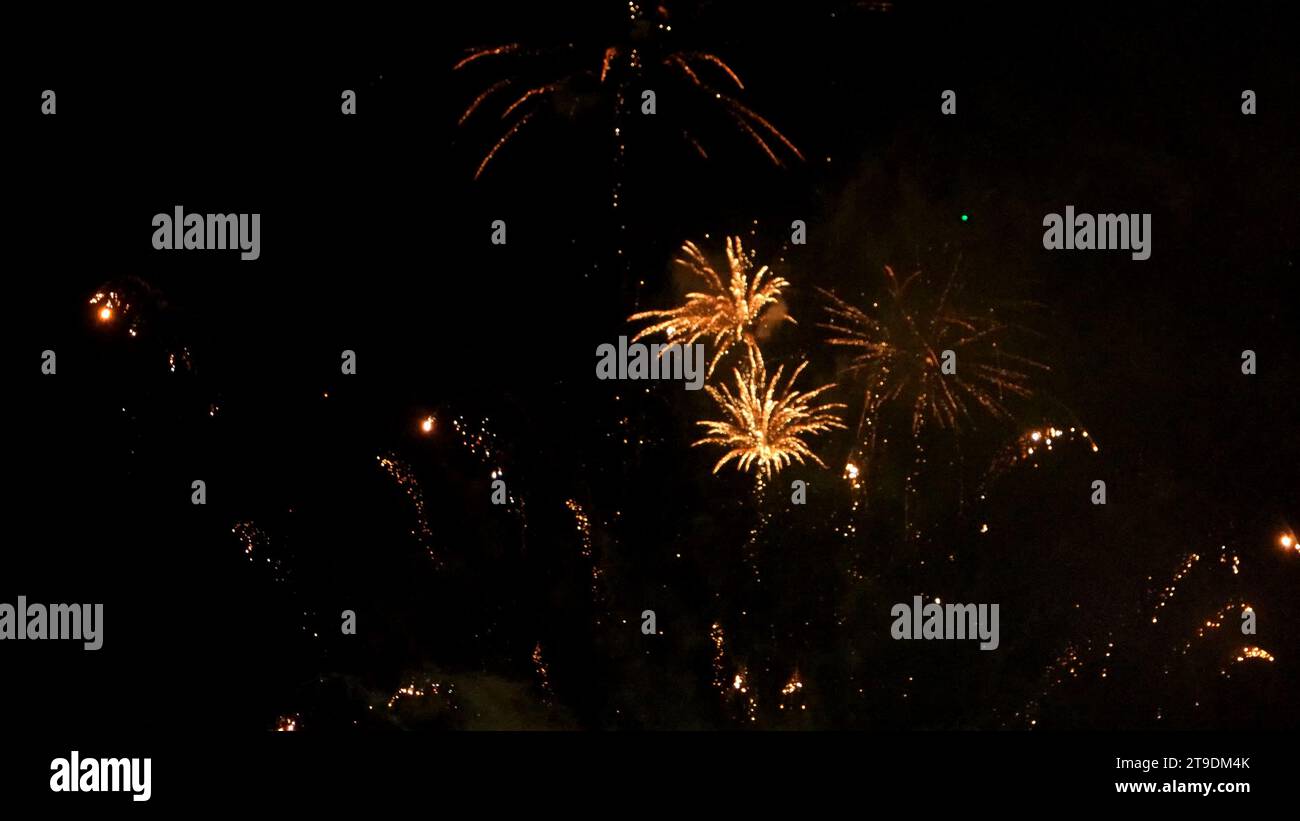 Multiple fireworks explosions on a dark night sky Stock Photo - Alamy