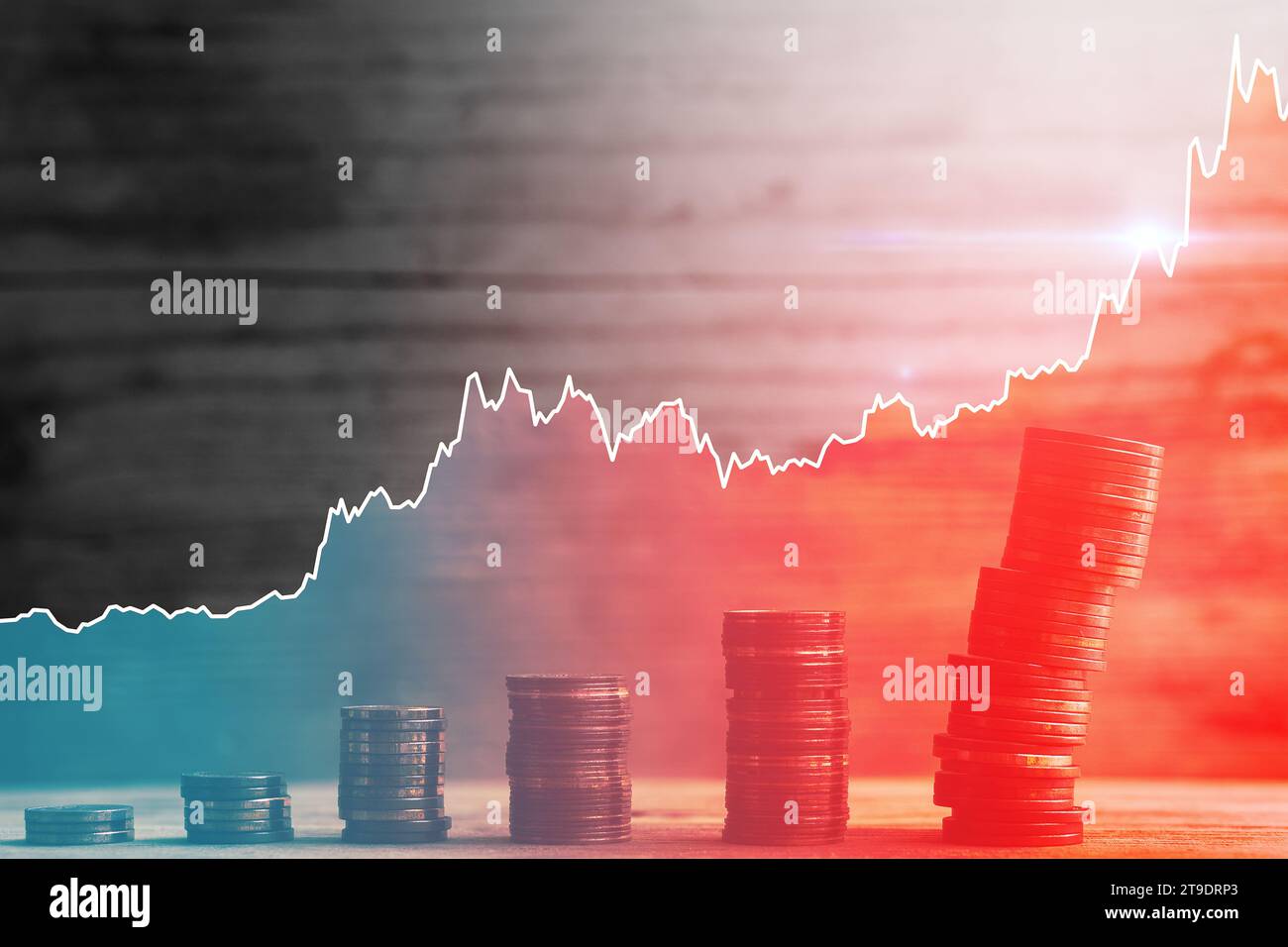 Unstable stacks of small value euro coins and rising sparkline chart ...