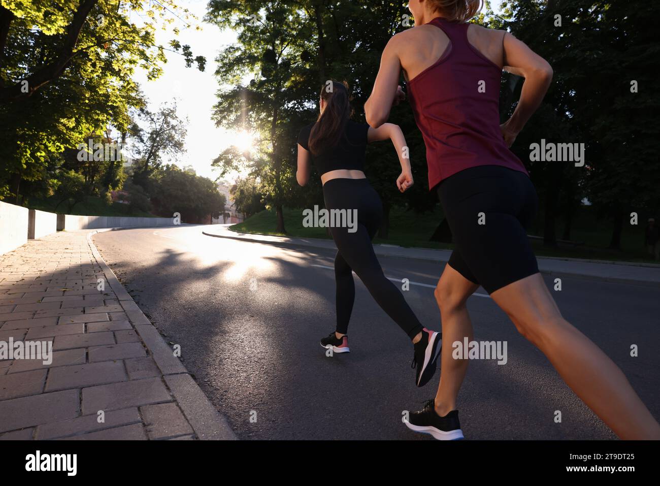 Two women on running track hi-res stock photography and images - Alamy