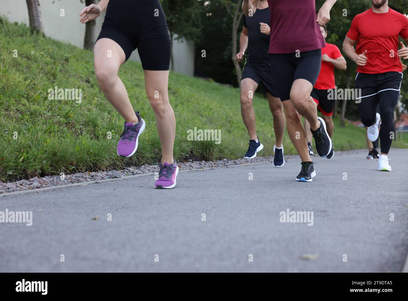 Group of people running outdoors, closeup view Stock Photo - Alamy
