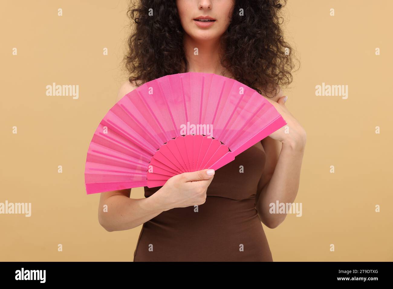Woman hand fanning in studio hi-res stock photography and images - Alamy