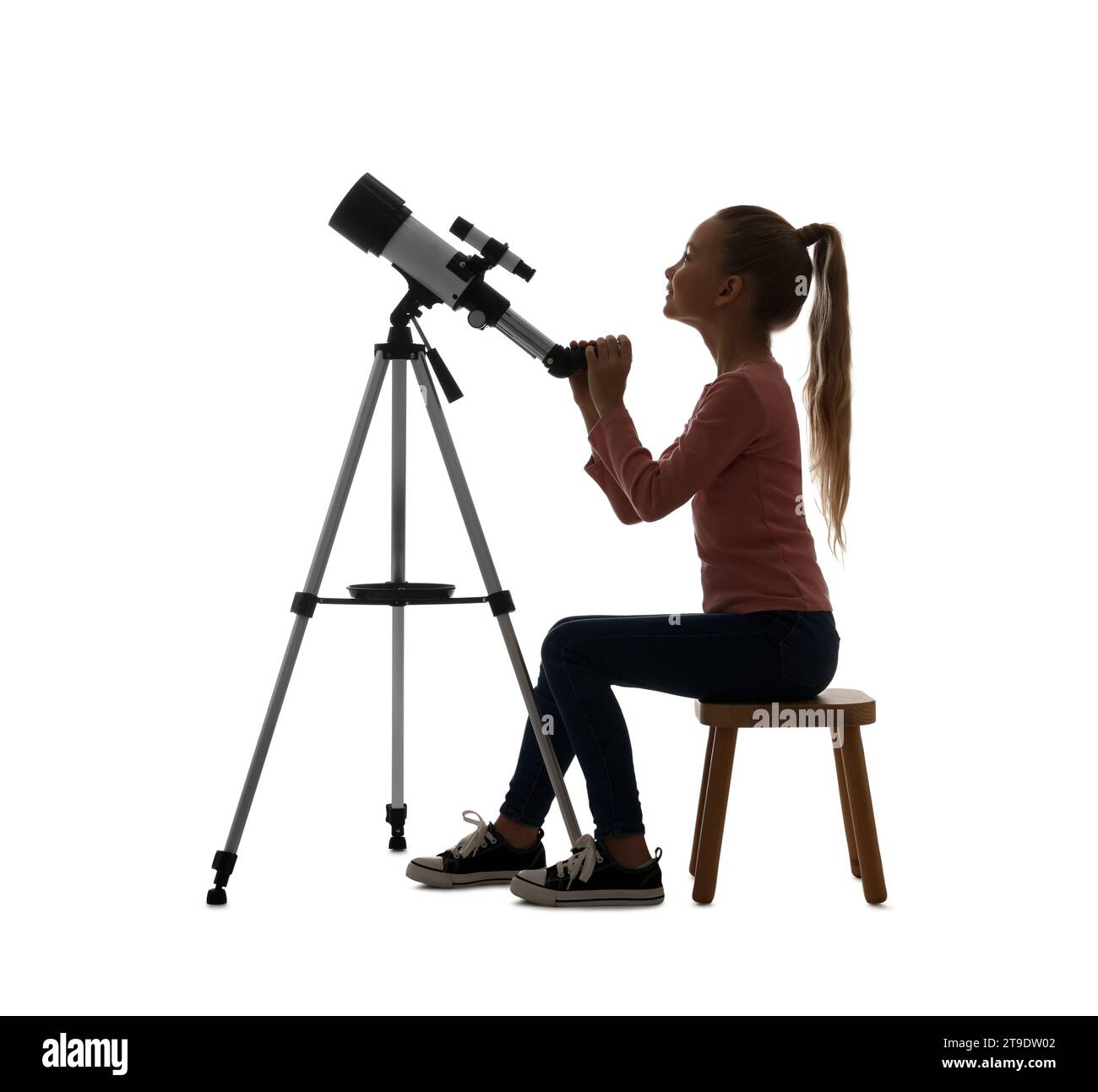 Happy little girl with telescope on white background Stock Photo - Alamy