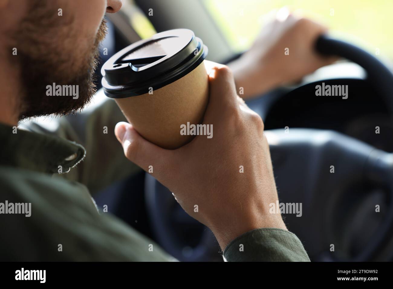 Man drinking coffee driving car hi-res stock photography and images - Alamy