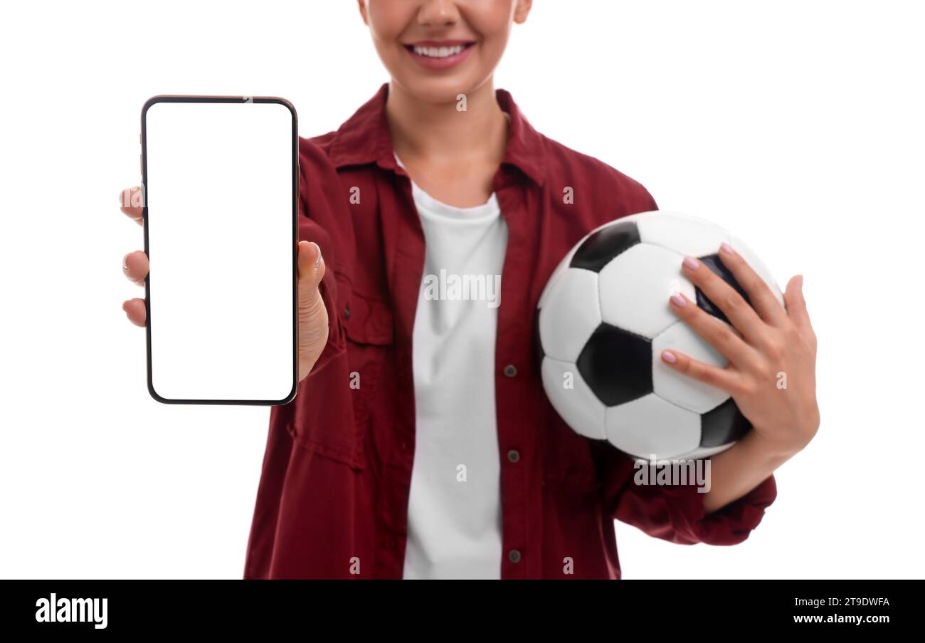 Happy sports fan with soccer ball and smartphone on white background ...