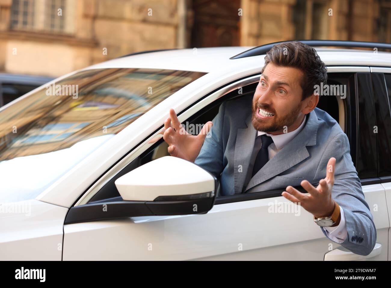 Angry driver screaming at someone from car in traffic jam Stock Photo ...