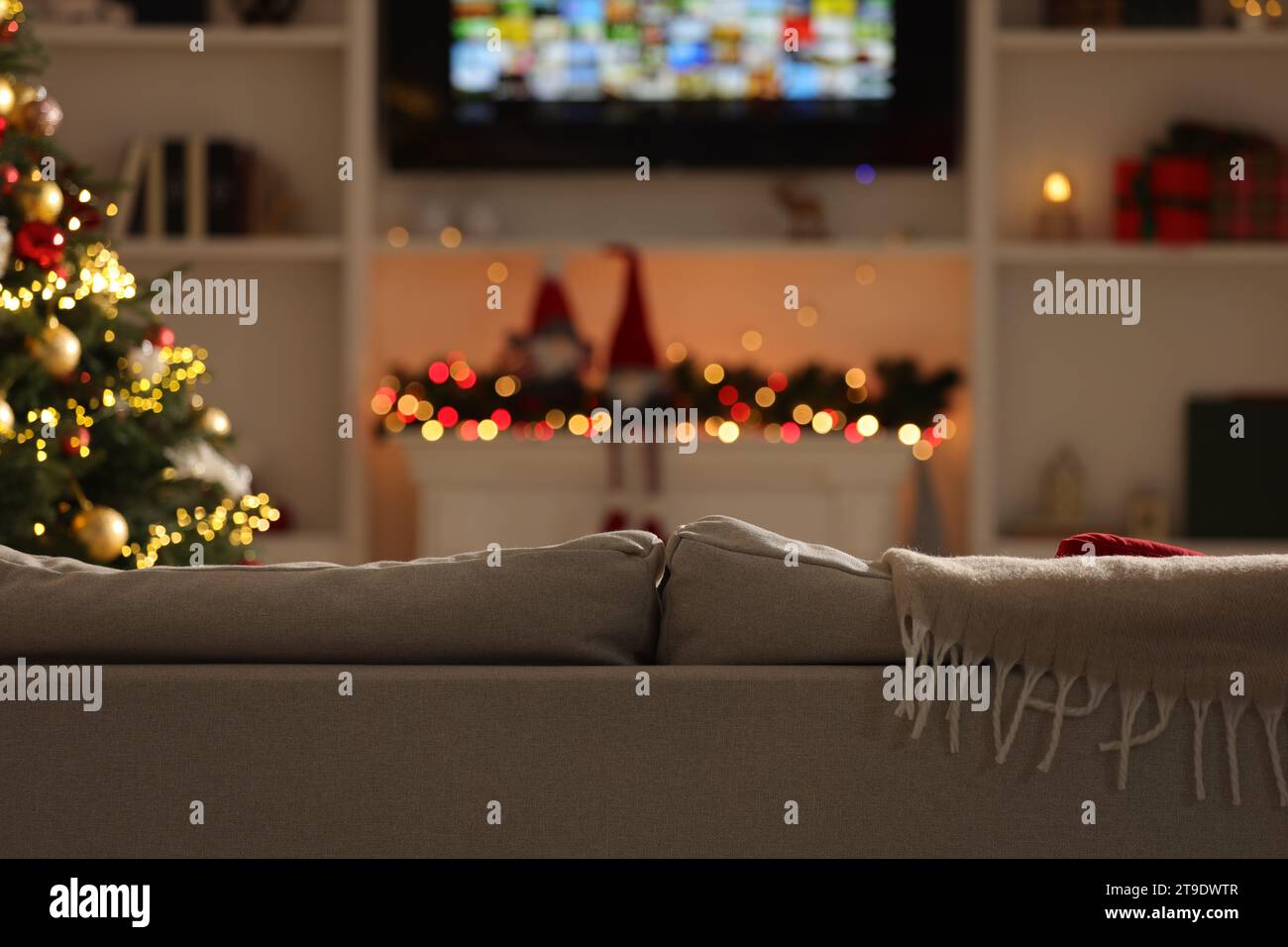 Living room interior with sofa and festive decor. Christmas celebration ...