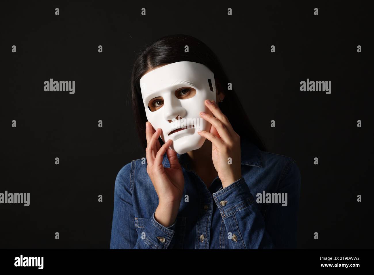 Multiple personality concept. Woman in mask on black background Stock ...