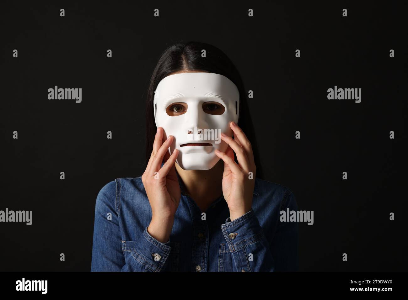 Multiple personality concept. Woman in mask on black background Stock ... Multiple personality concept. Woman in mask on black background Stock ...