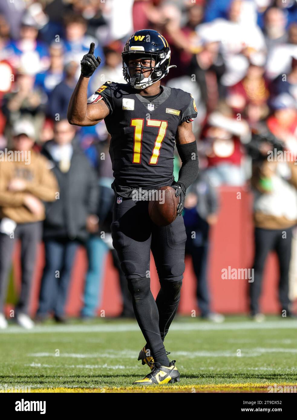 Washington Commanders wide receiver Terry McLaurin (17) motioning for the first down conversion ...