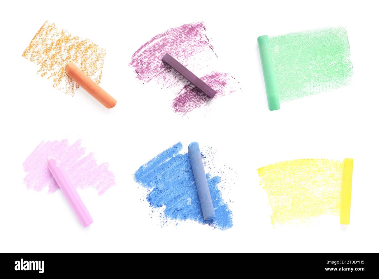 Colorful soft pastels and scribbles on white background, top view ...