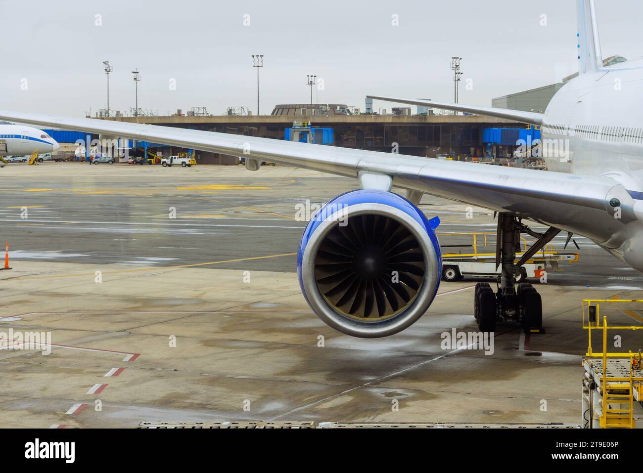 Several passenger planes are being serviced by ground services before ...