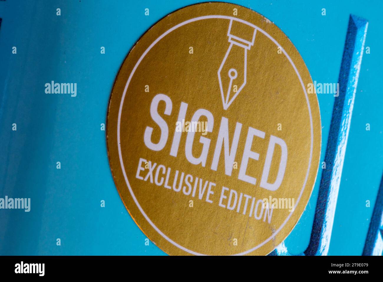 Close up of a "signed exclusive addition" sticker on the cover of a ...