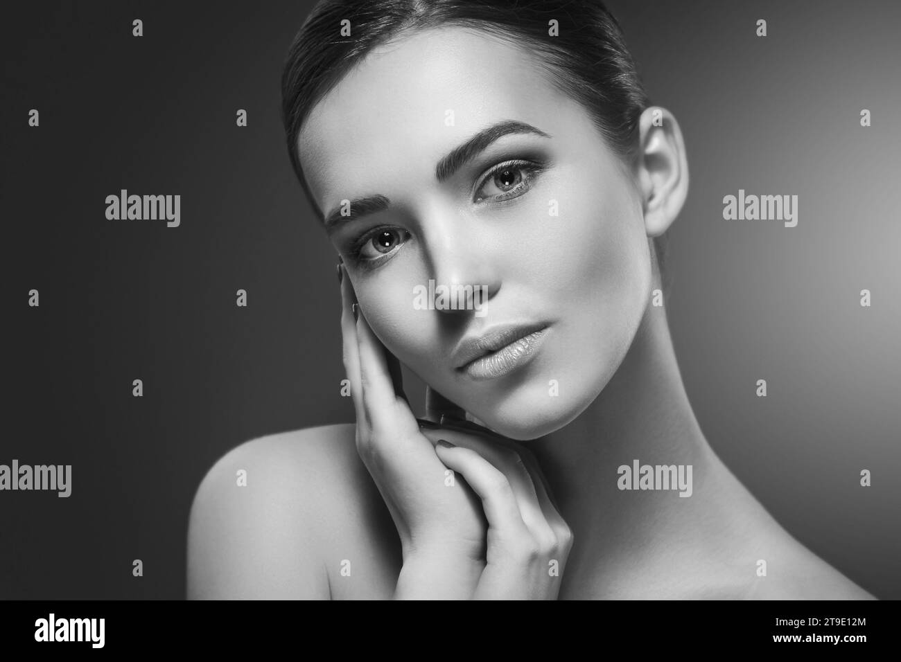 Portrait of beautiful young woman with natural makeup and smooth skin ...