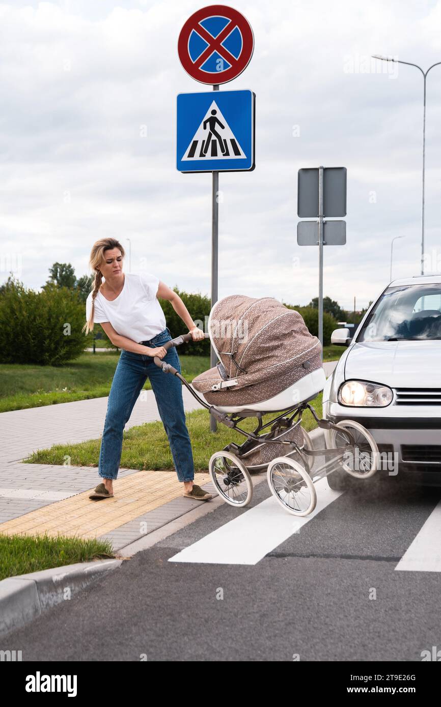 Mother on the crosswalk after car accident when vehicle hits her baby ...