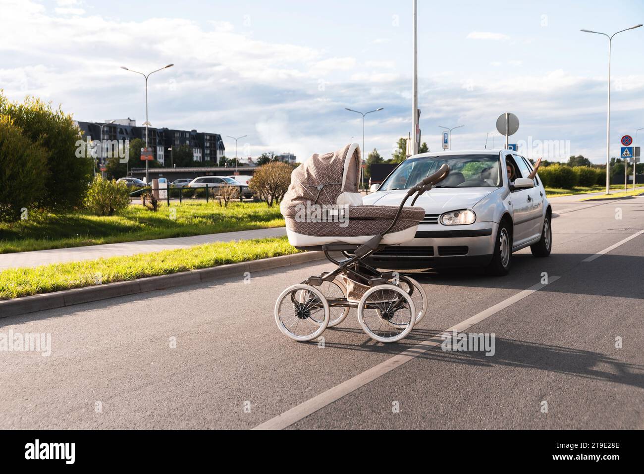 Outraged driver and baby pram rolled out in the middle of the road ...