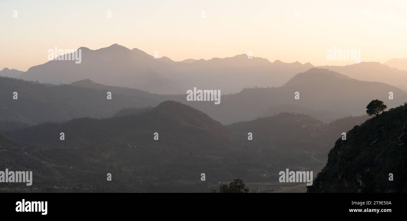 The beauty of the sunset over the rolling hills in the Himalaya ...
