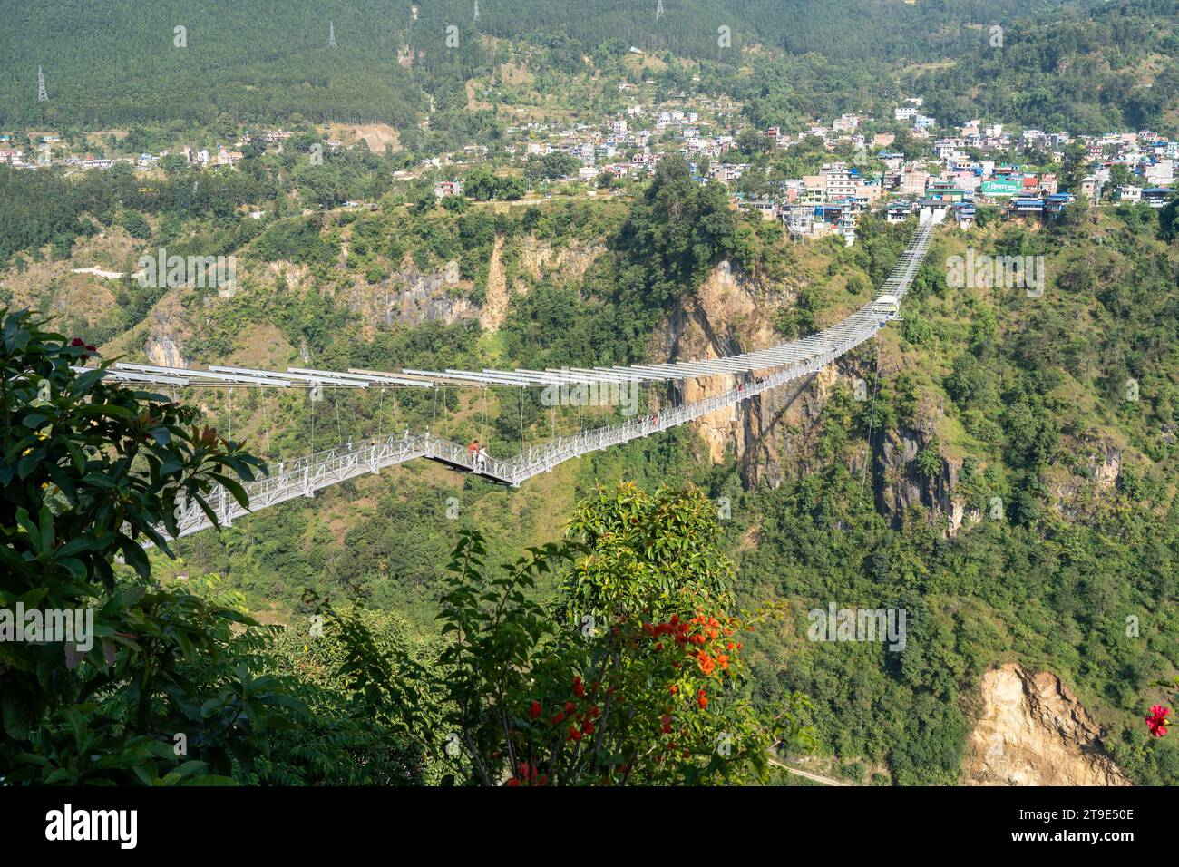 A suspension bridge with bungee jumping across a deep gorge in Kushma ...