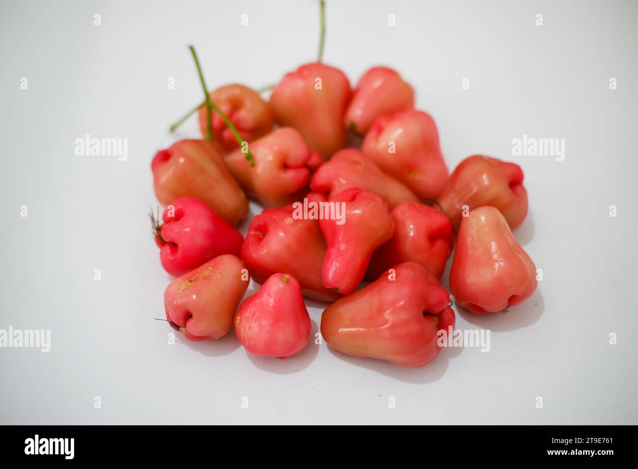Fresh red water guava just picked on a white background Stock Photo - Alamy