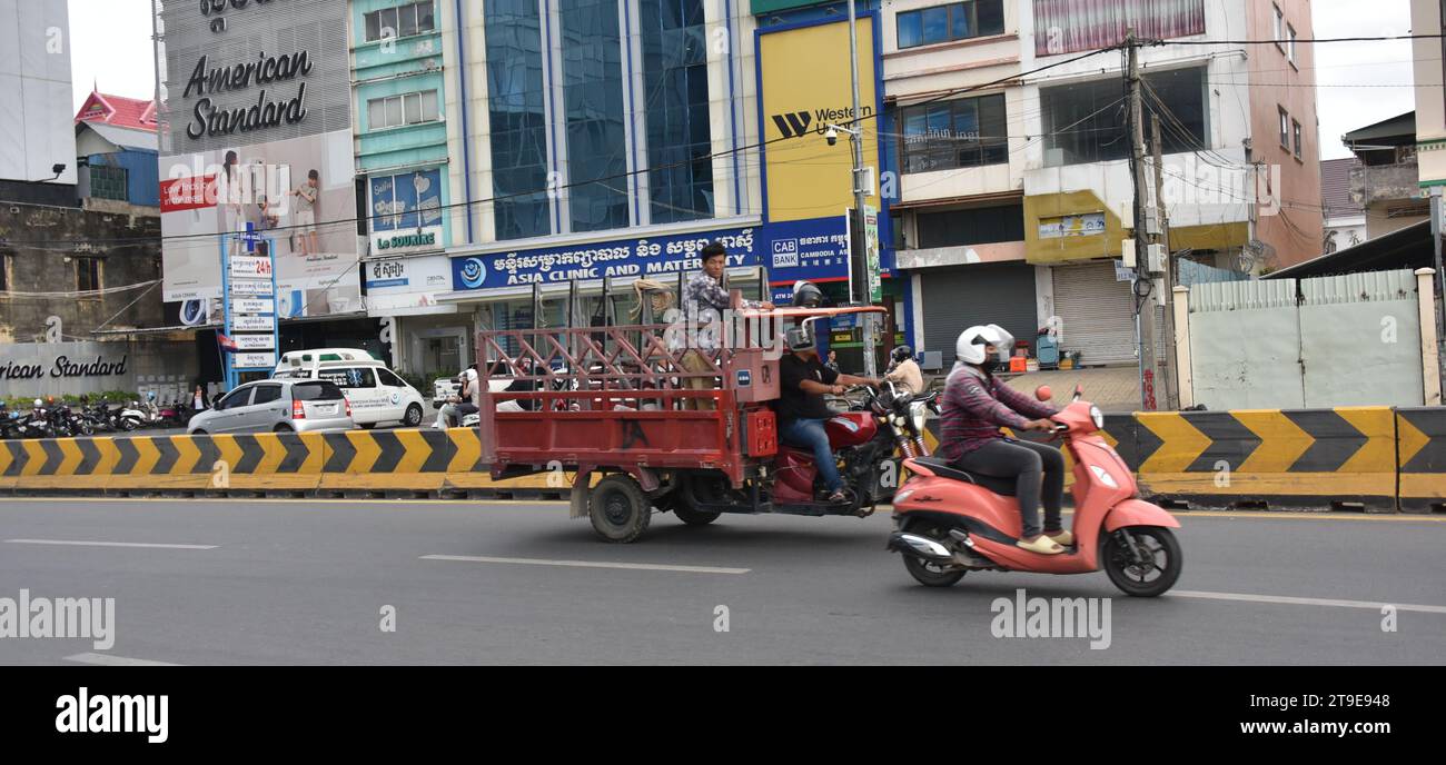large tuk tuk, pulled by a motorbike, a very common taxi in Phnom Penh ...