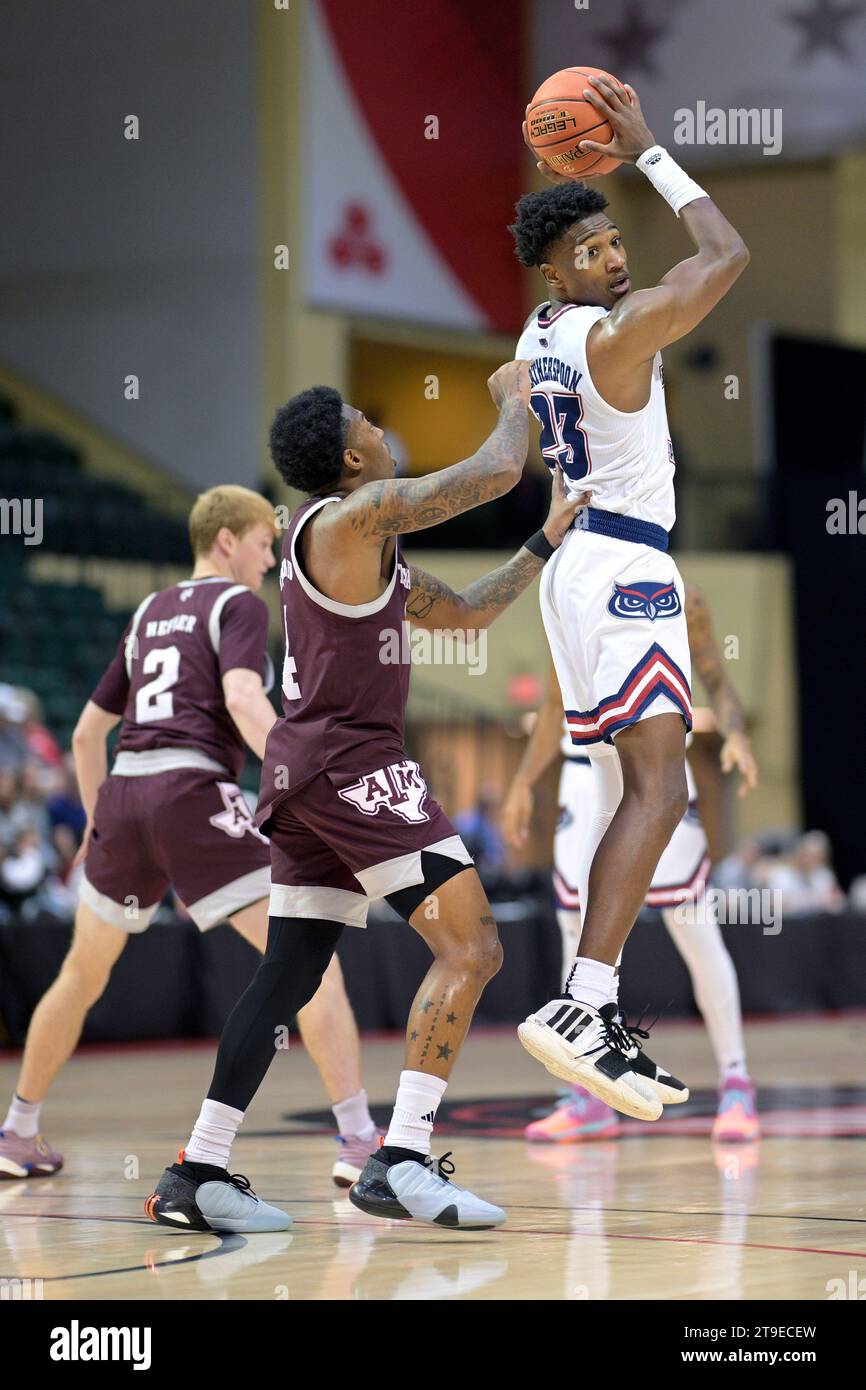 Florida Atlantic guard Brandon Weatherspoon (23) is defended by Texas A ...