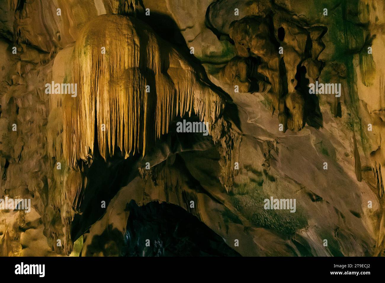 Natural dark and scary underground cave with strangely shaped stone ...
