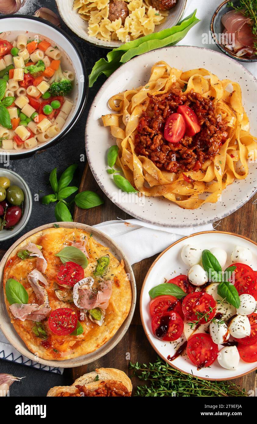 Italian food dishes on dark background. Traditional food concept. Top ...