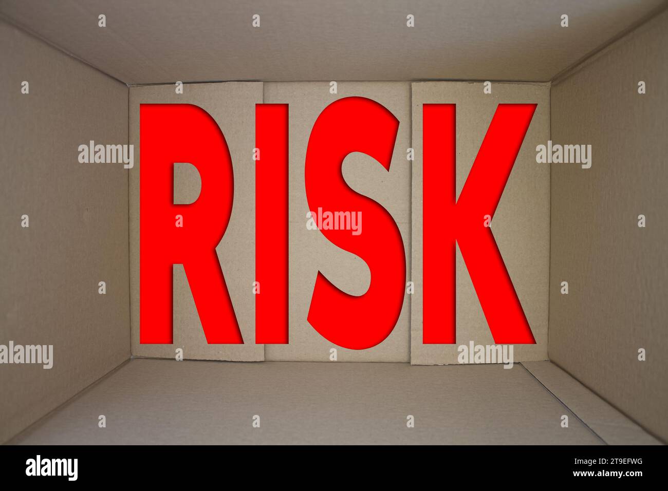 Risk word with cardboard box. Brown folded card box Stock Photo - Alamy