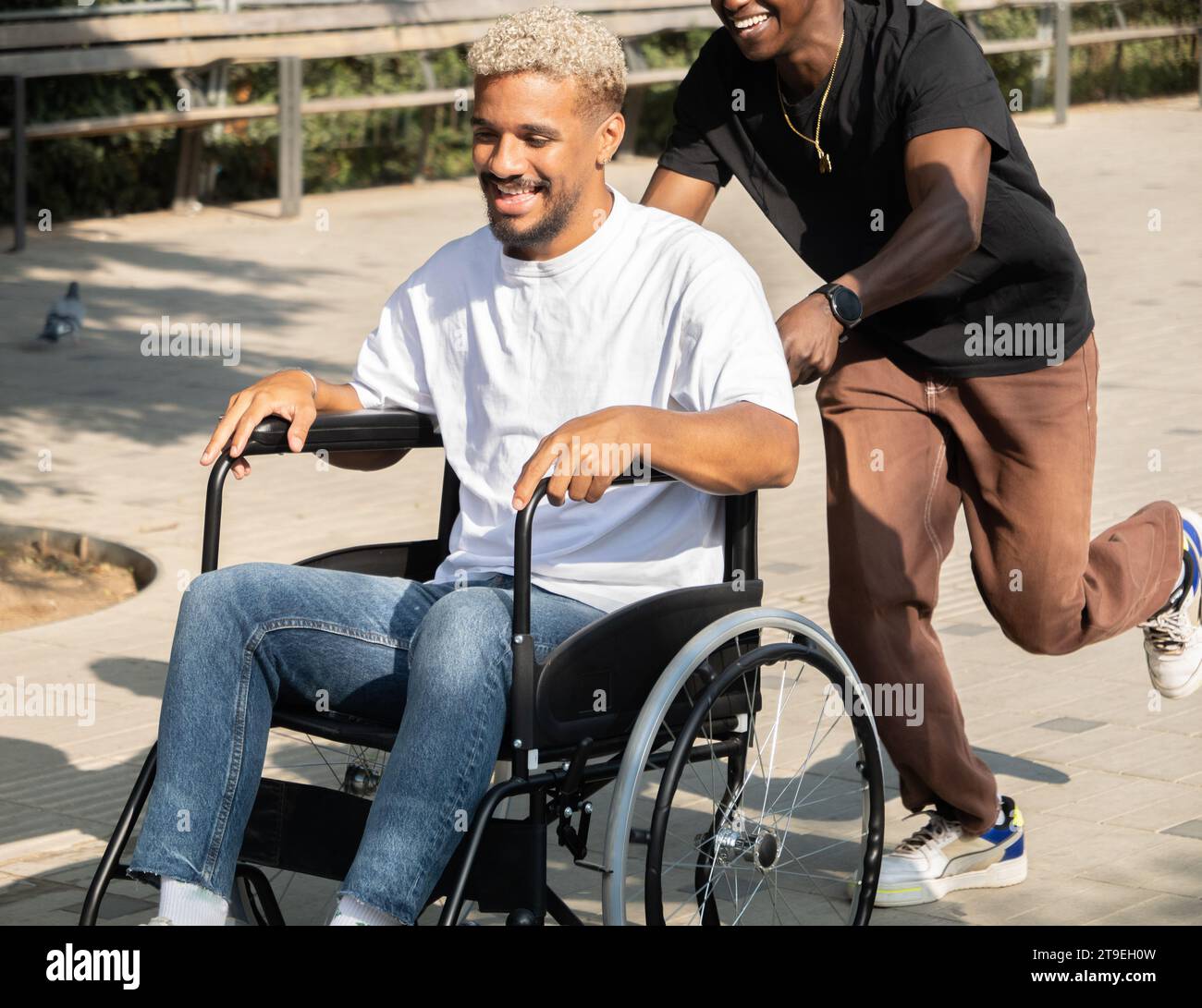 Diversity walking wheelchair hi-res stock photography and images - Alamy