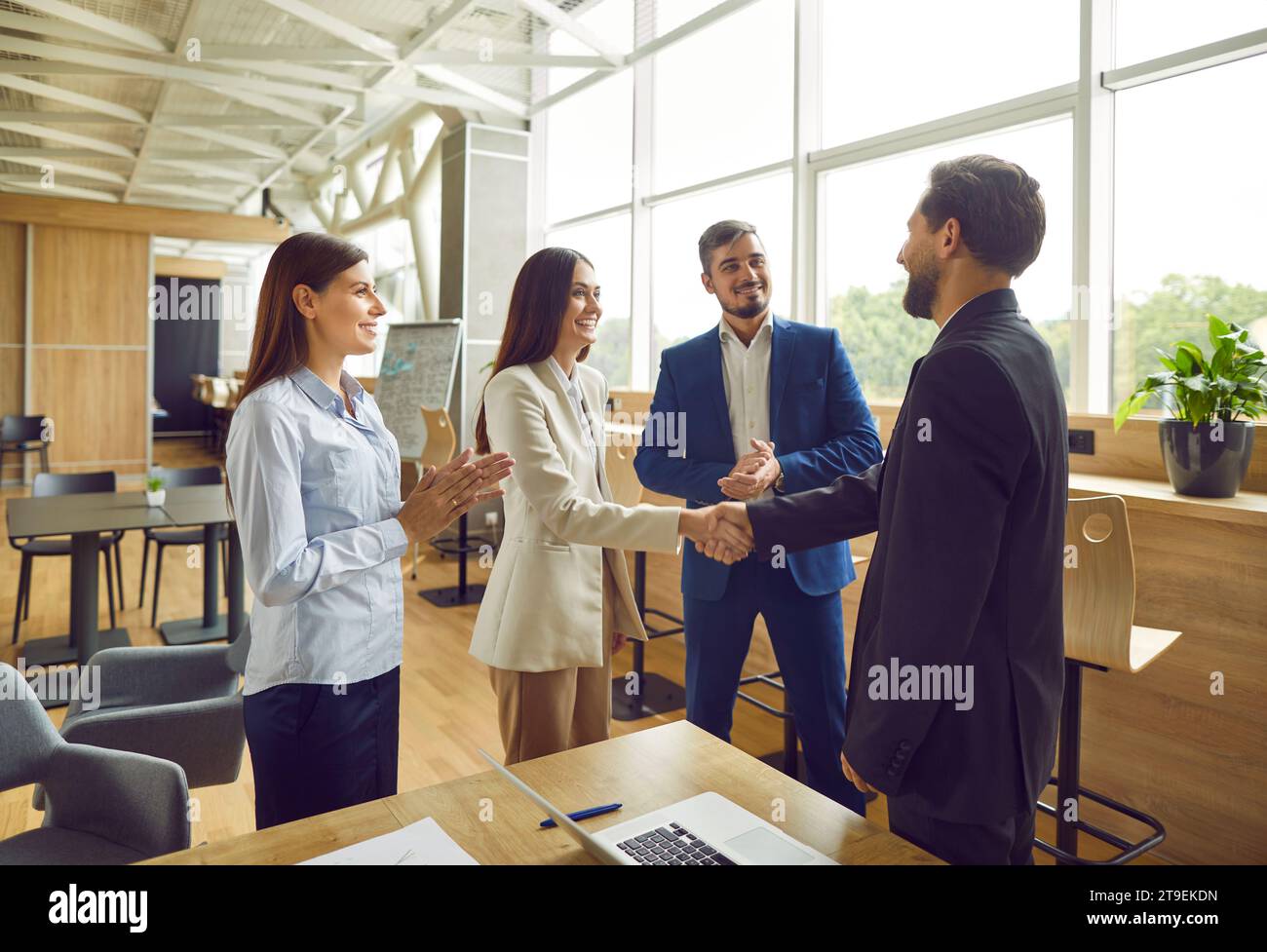 Business people meet in office, negotiate deals, make agreements and ...