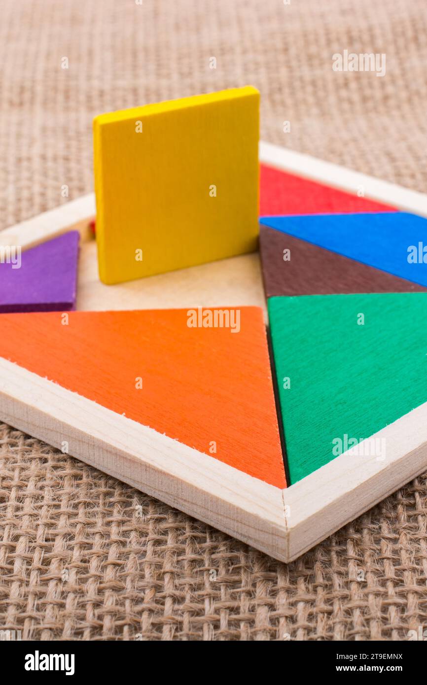 Colorful pieces of a square tangram puzzle Stock Photo - Alamy