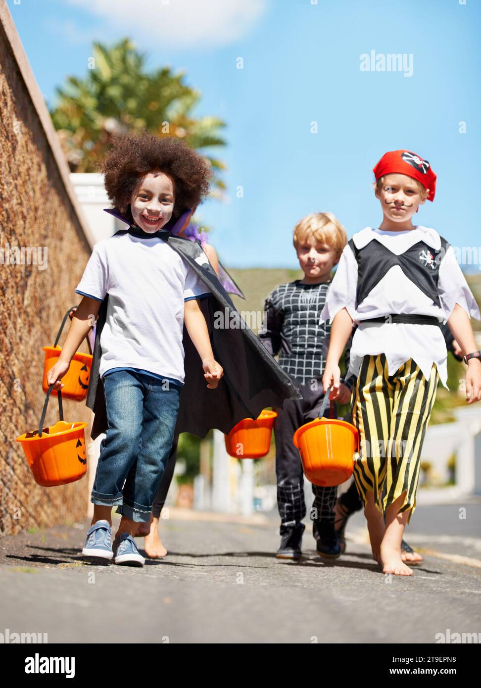 Halloween, children or trick and treat portrait outdoor in neighborhood ...