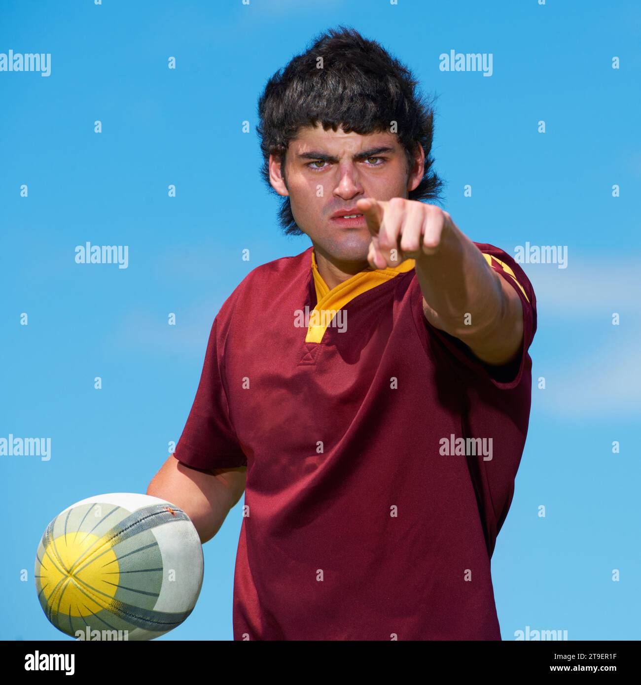 Pointing, hand and serious rugby player with a ball for game practice ...