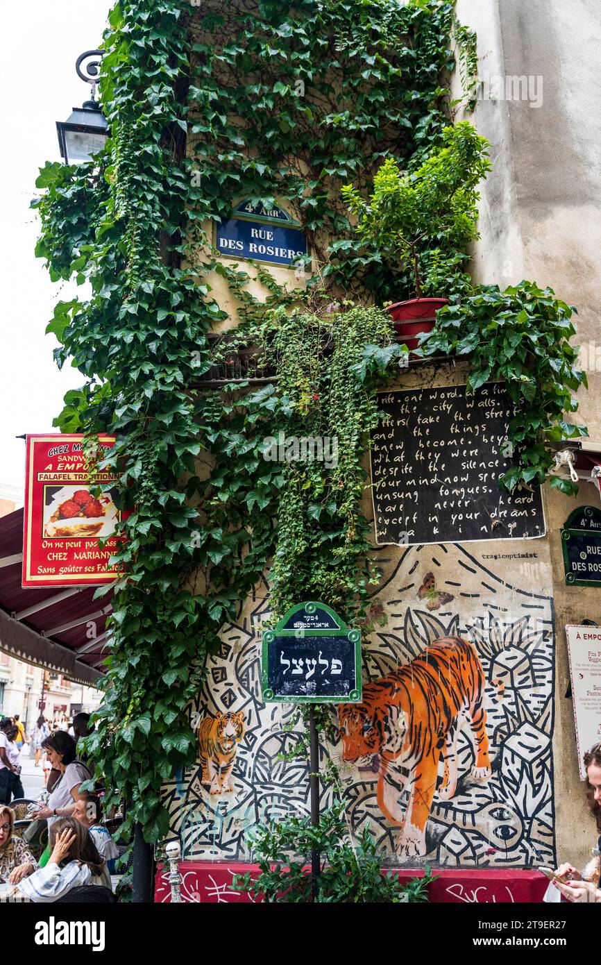 Traditional street sign of Rue des Rosiers, in the Jewis quarter ...