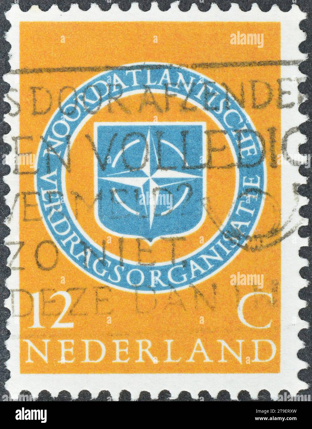 Cancelled postage stamp printed by Netherlands, that shows NATO emblem ...