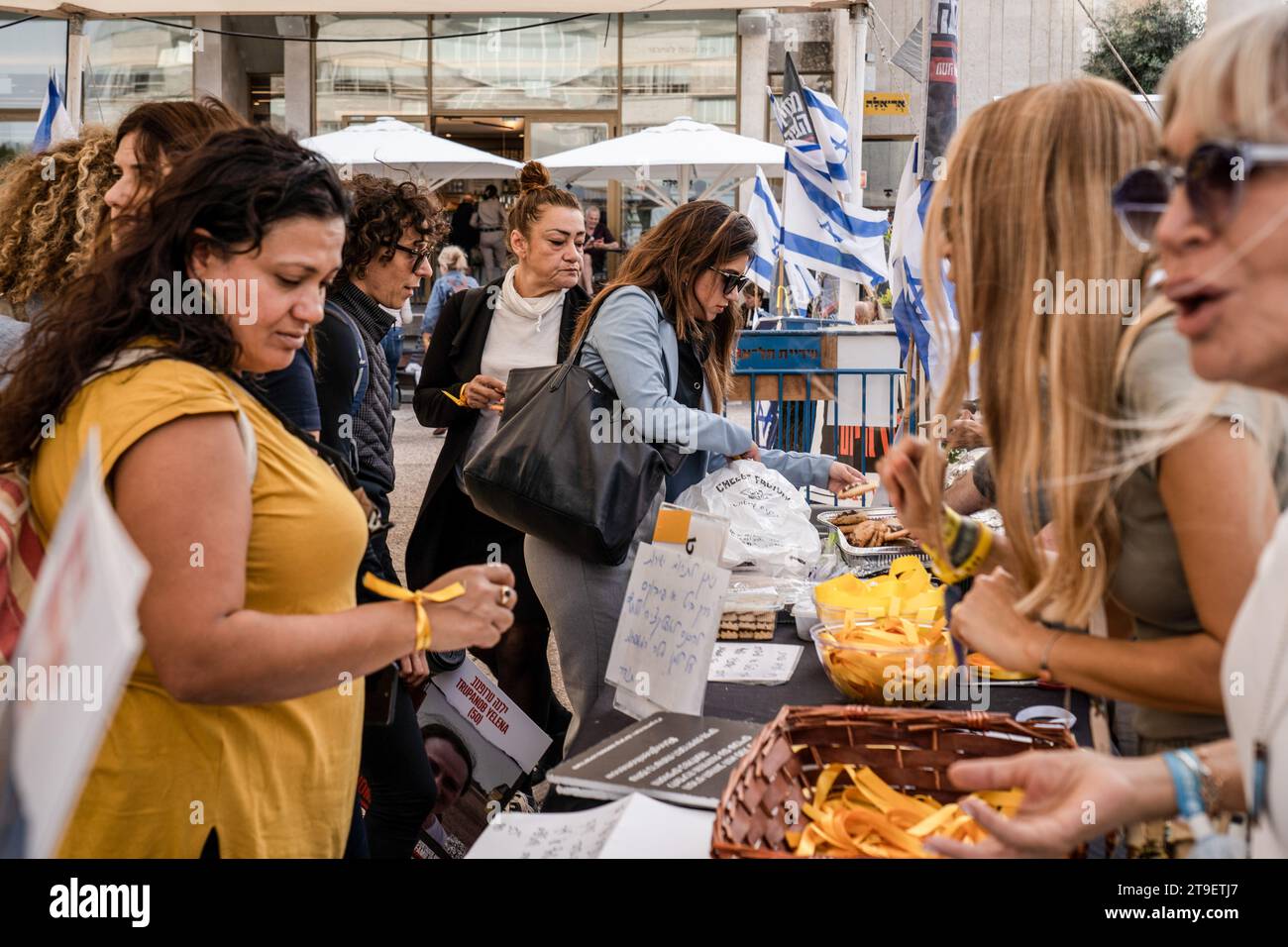 Tel Aviv, Israel. 22nd Nov, 2023. A woman seen wearing a yellow ribbon ...