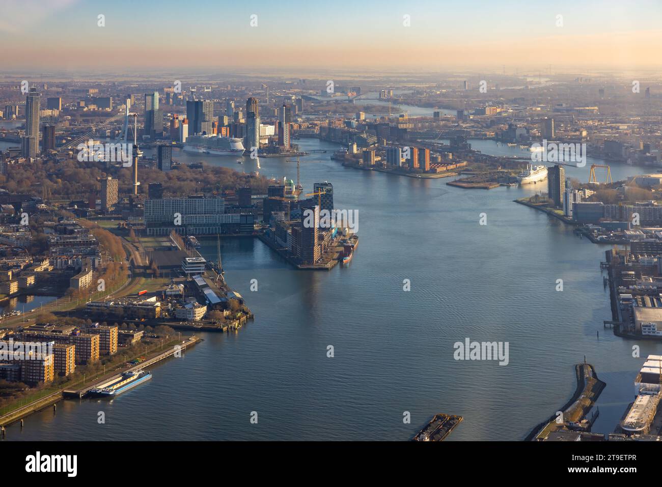 Aerial view Dutch river Nieuwe Maas near Rotterdam with harbors and ...