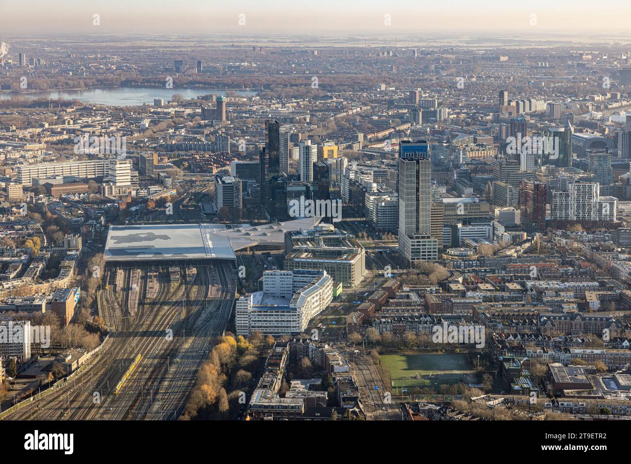 Aerial view Dutch city Rotterdam with residential area and main railway ...