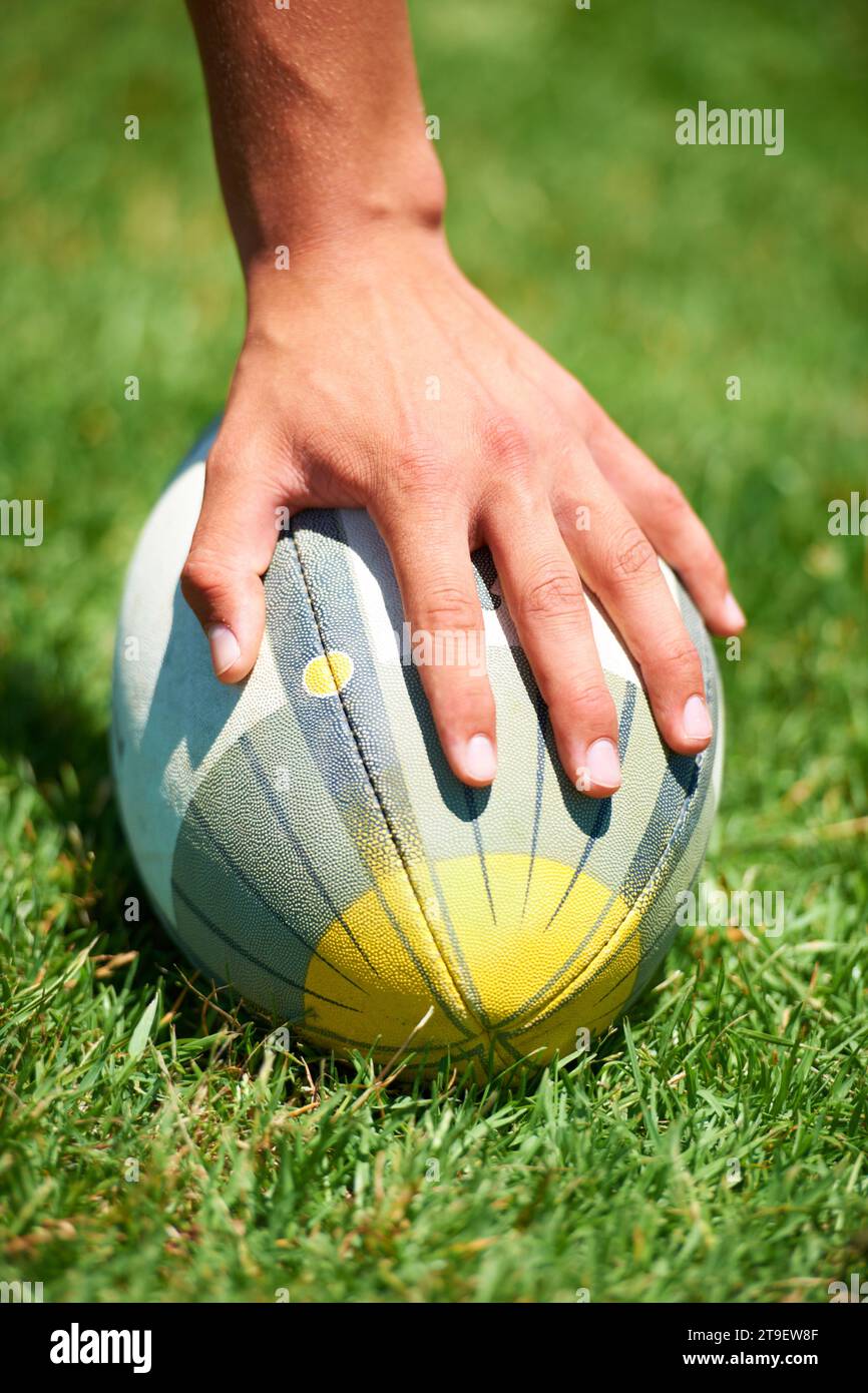 Closeup, rugby and leg with a ball of a player to kick for fitness ...