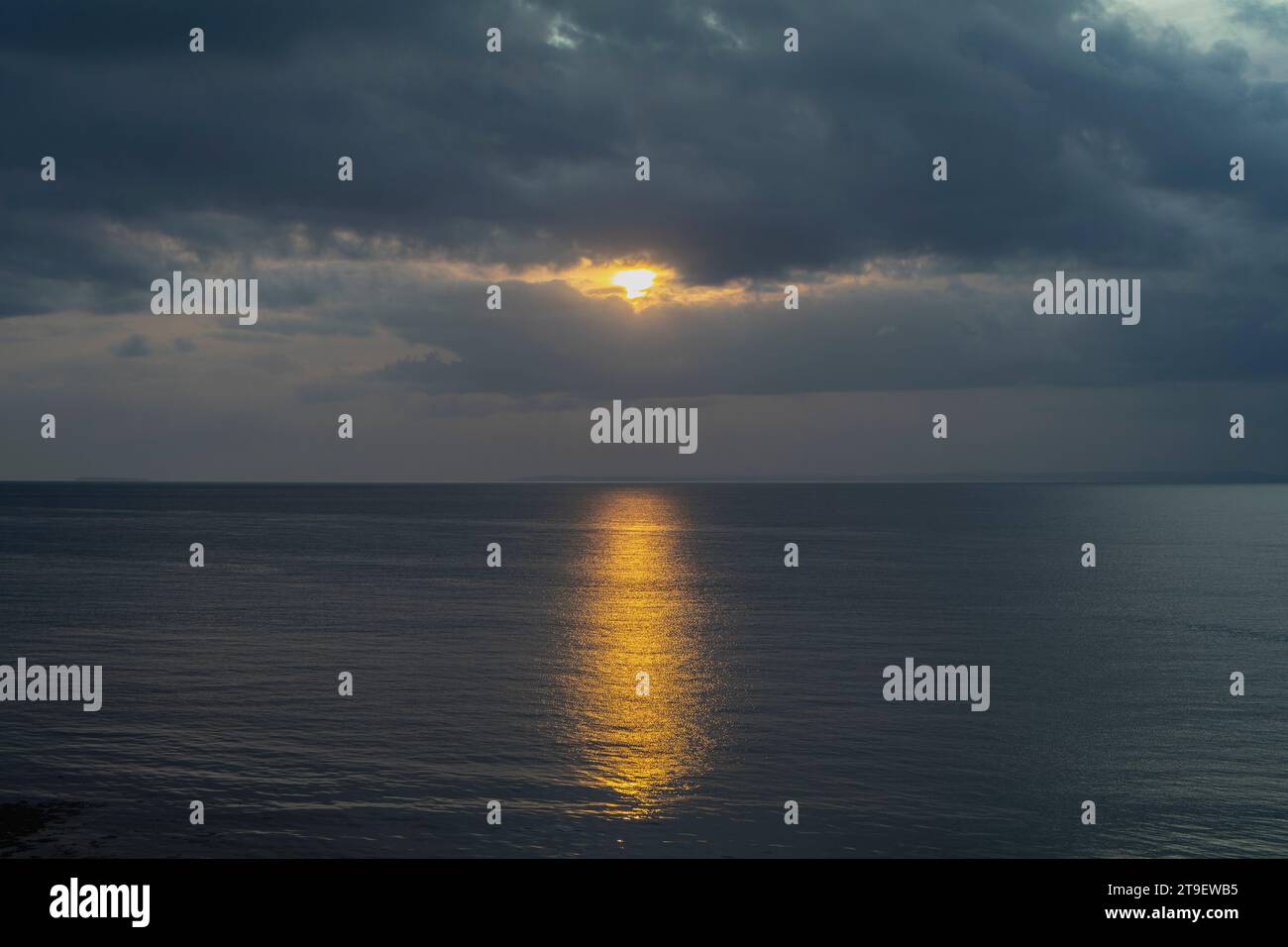 The sun disappeared behind some cloud cover with a streak of sunlight ...