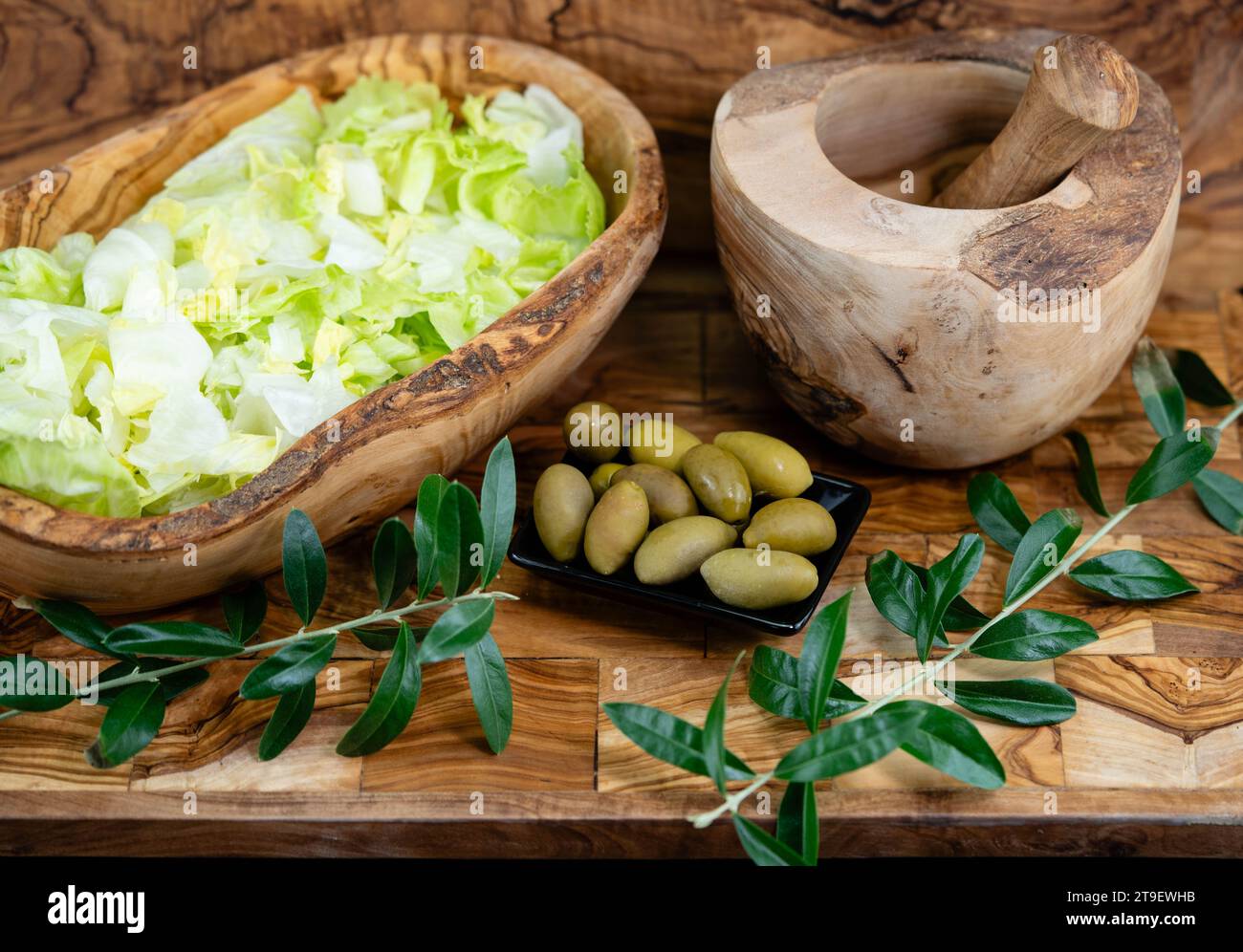 cold pressed extra virgin olive oil on olive wood Stock Photo - Alamy