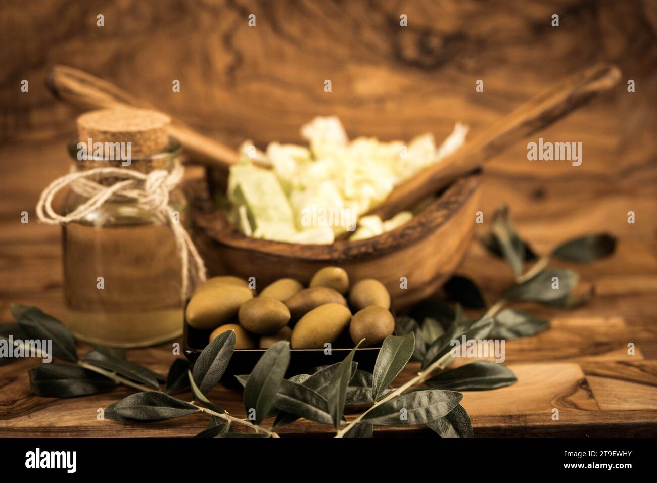 cold pressed extra virgin olive oil on olive wood Stock Photo - Alamy