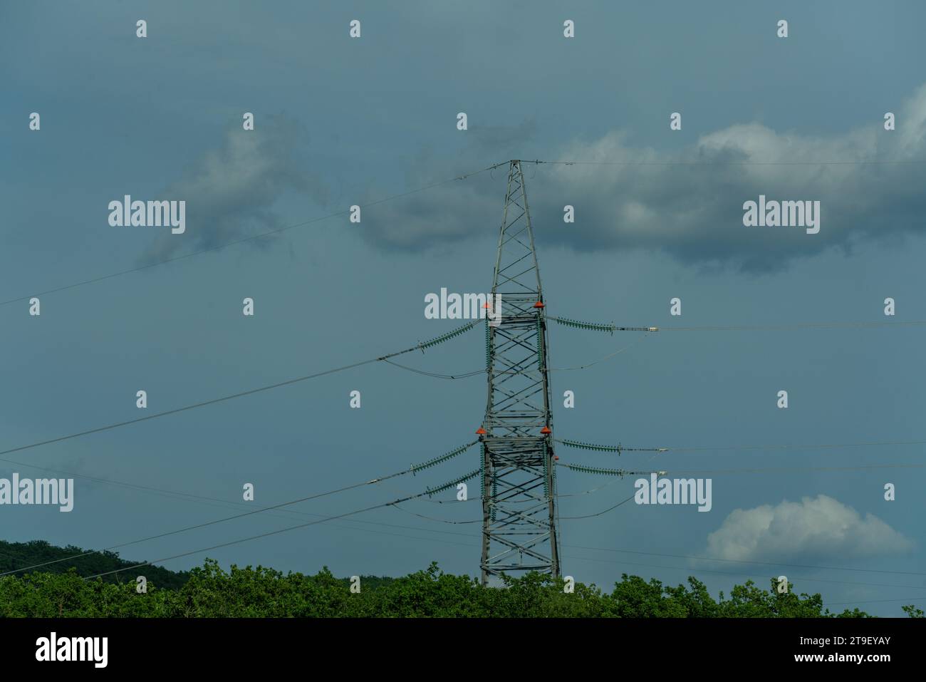 High voltage towers with sky background. Power line support with wires ...